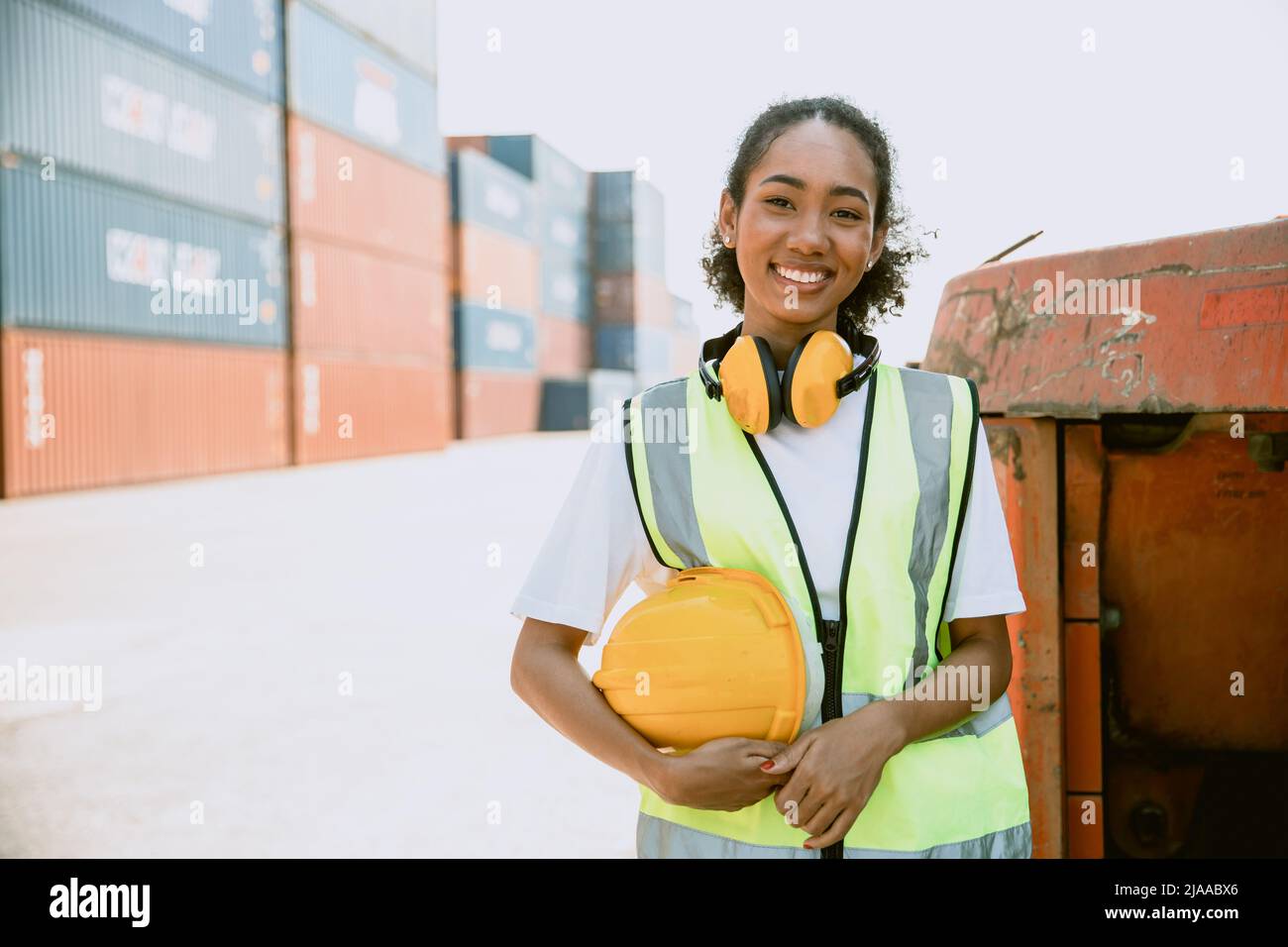African teen black woman worker work in port cargo shipping portait ...
