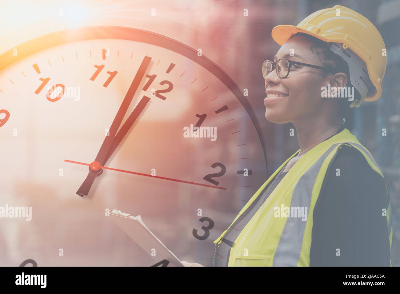 Engineer black smart woman worker in factory overlay with time clock ...