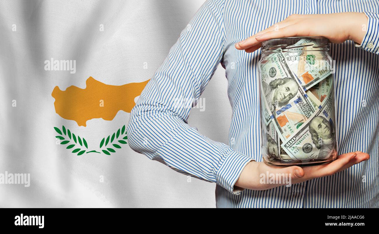 US dollar banknotes against Republic of Cyprus flag background Stock ...