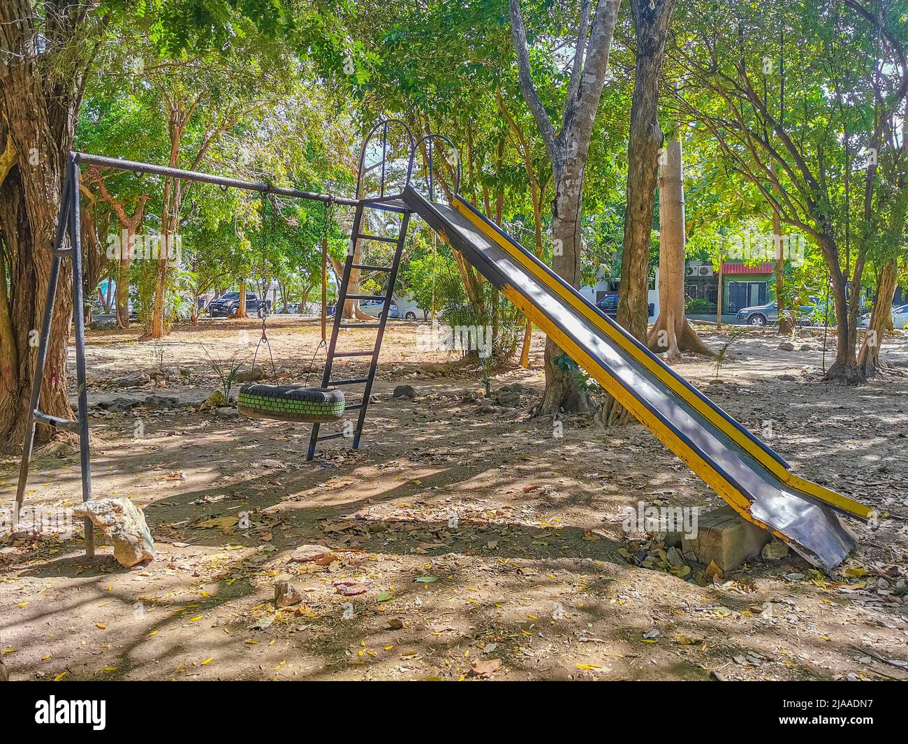 Slide and climbing frame on a playground in a park in Playa del Carmen ...