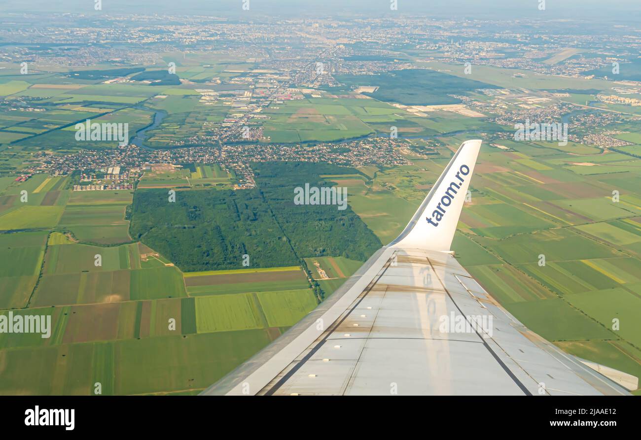 Flying over Romania, near Bucharest, Otopeni - aerial view with a wing ...