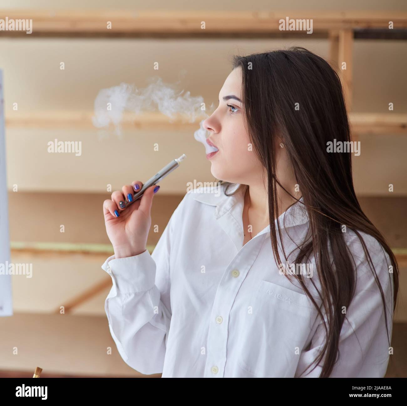 Happy vaper girl with vaping device in hand.Quit smoking nicotine ...
