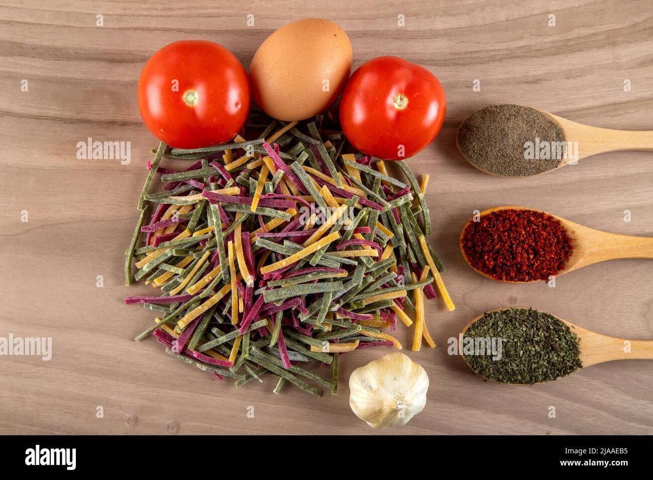 Traditional Turkish colors noodles with tomatoes, eggs and spices Stock ...
