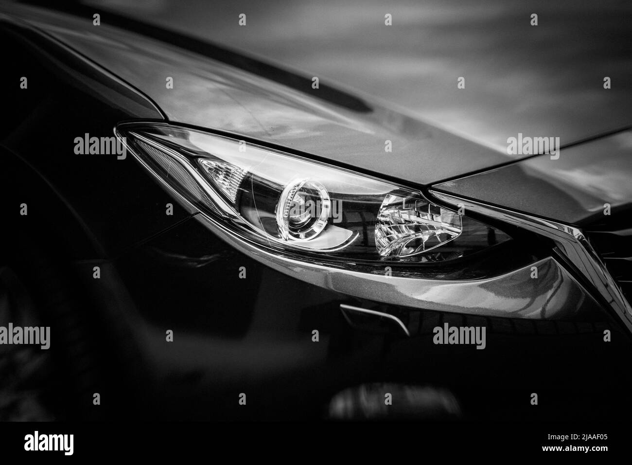 Modern car headlight close-up Stock Photo - Alamy