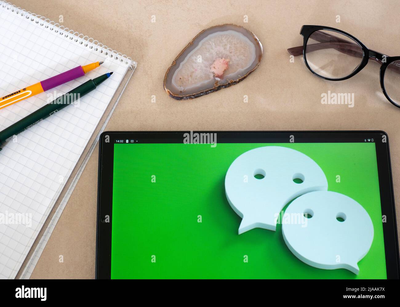 In this photo illustration WeChat logo seen displayed on a tablet Stock ...