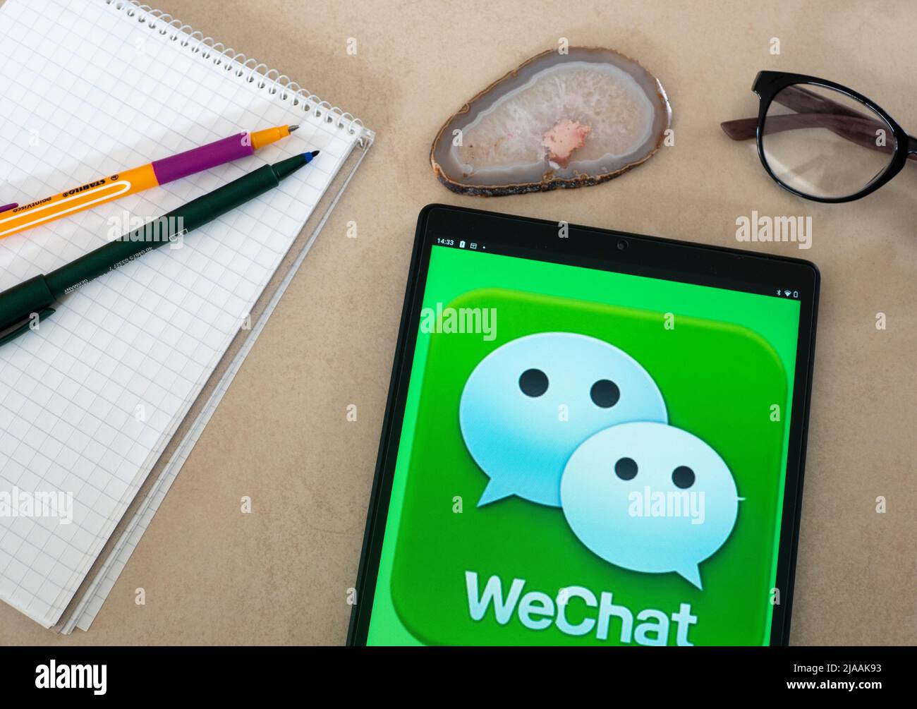 In this photo illustration WeChat logo seen displayed on a tablet Stock ...