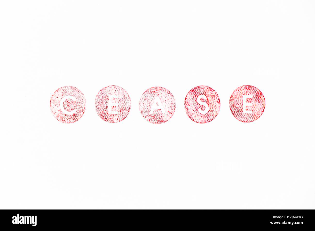 Red color rubber stamp in word cease on white paper background Stock ...
