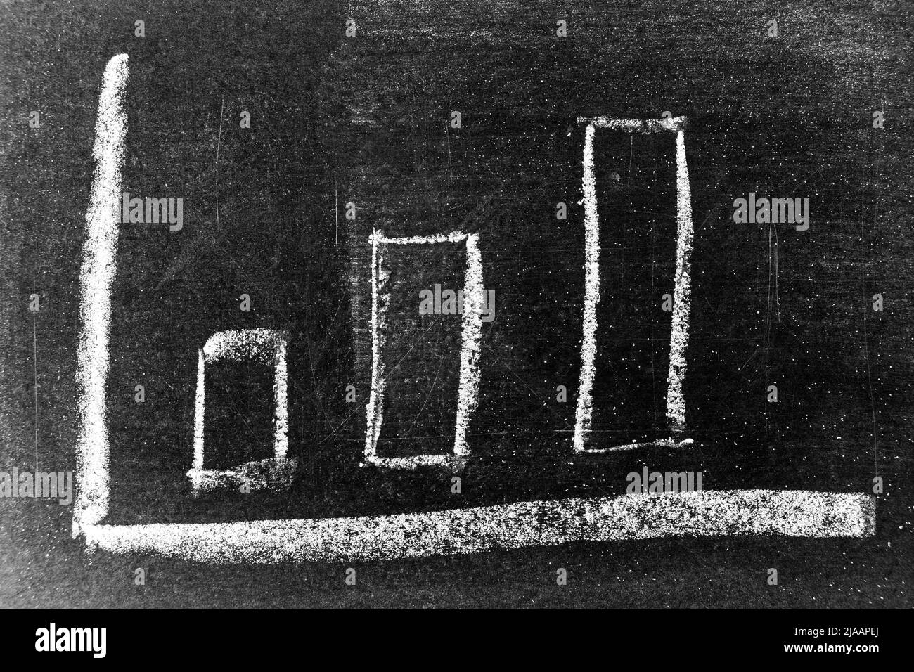 White color chalk drawing as upward bar graph on blackboard or ...