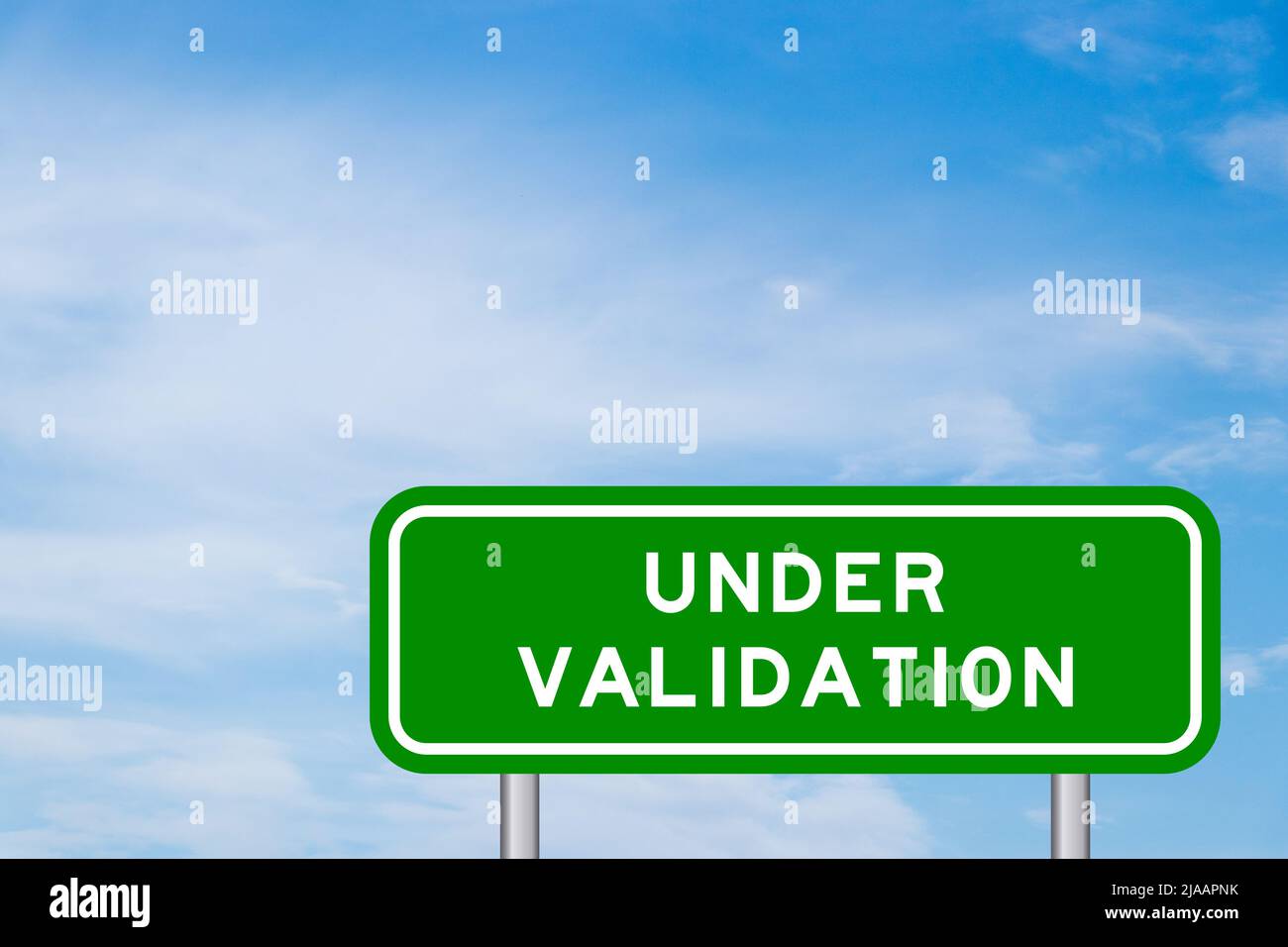 Green color transportation sign with word under validation on blue sky ...