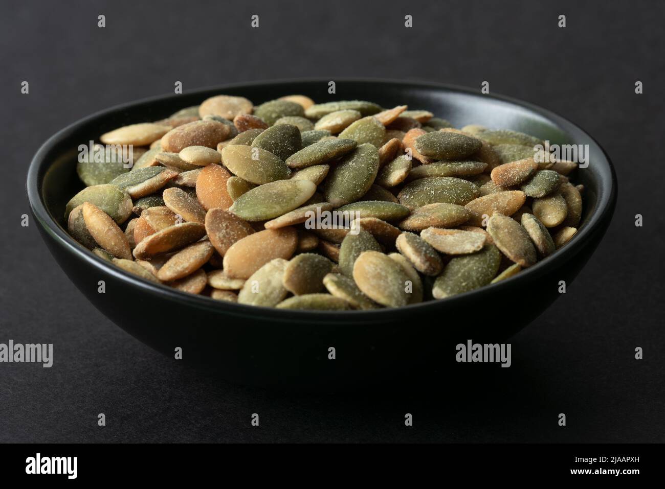 Roasted Salted Pepita Seeds in a Bowl Stock Photo - Alamy