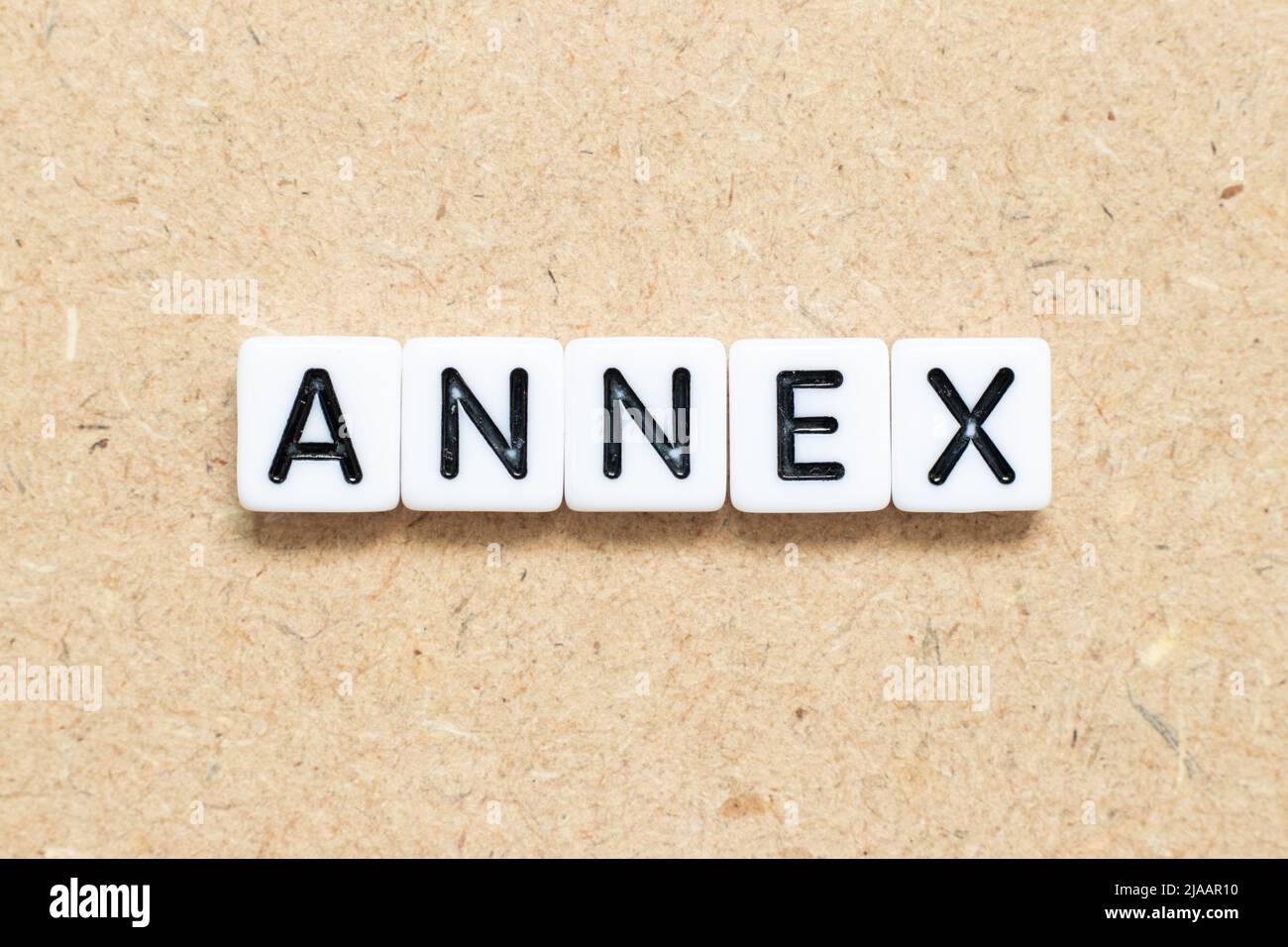 White tile alphabet letter with word annex on wood background Stock ...