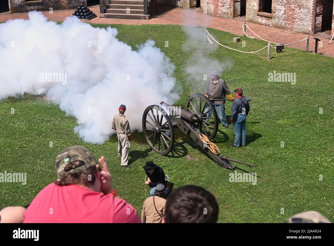Civil War re-enactors fire a cannon at Fort Macon, originally ...