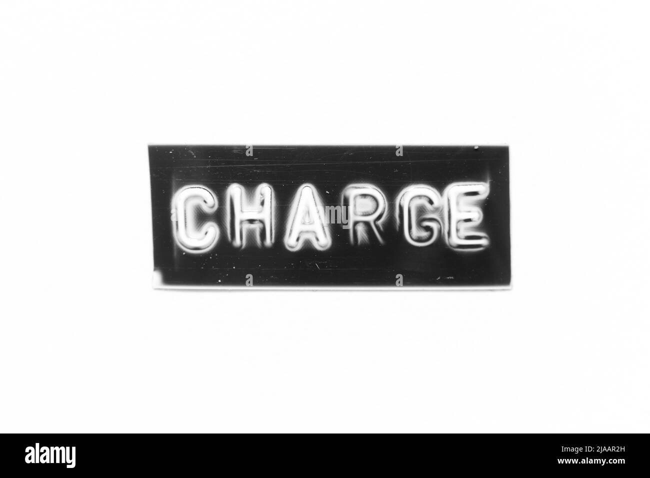 Black color banner that have embossed letter with word charge on white ...