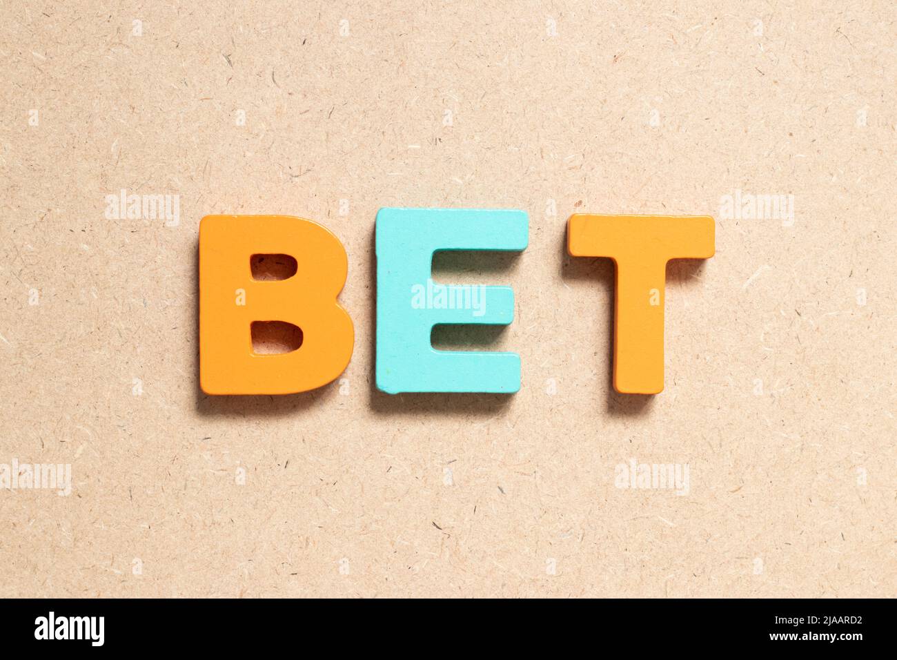Color alphabet letter in word bet on wood background Stock Photo - Alamy