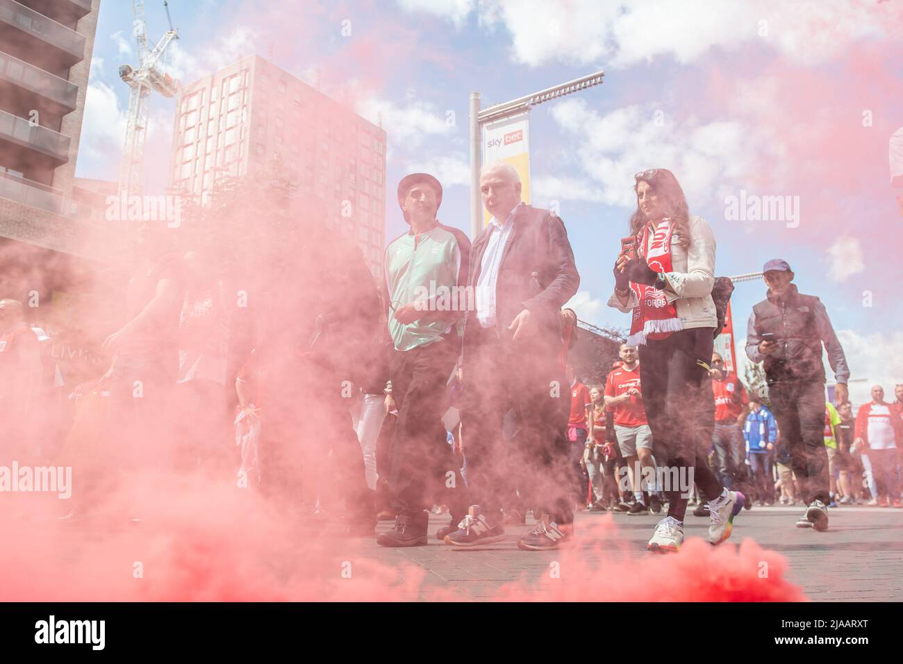 Fans arrive at Wembley Stadium through flare smoke Stock Photo - Alamy