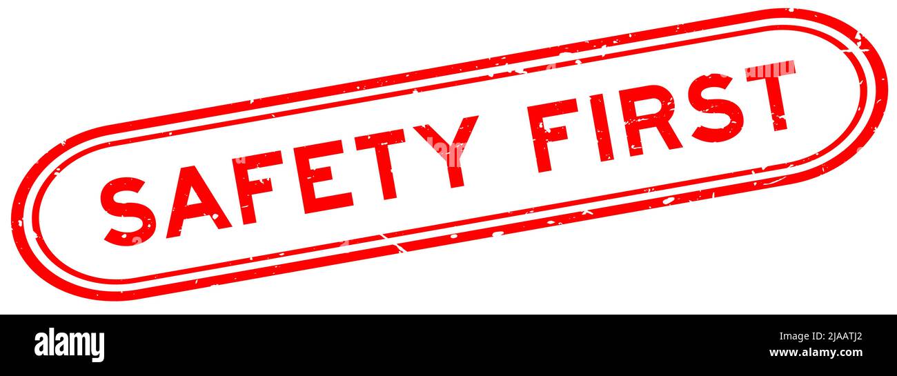 Grunge red safety first word rubber seal stamp on white background ...