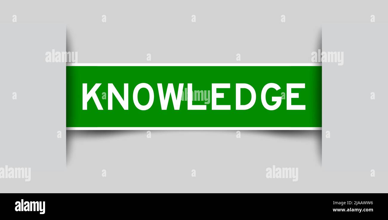 Inserted green color label sticker with word knowledge on gray ...