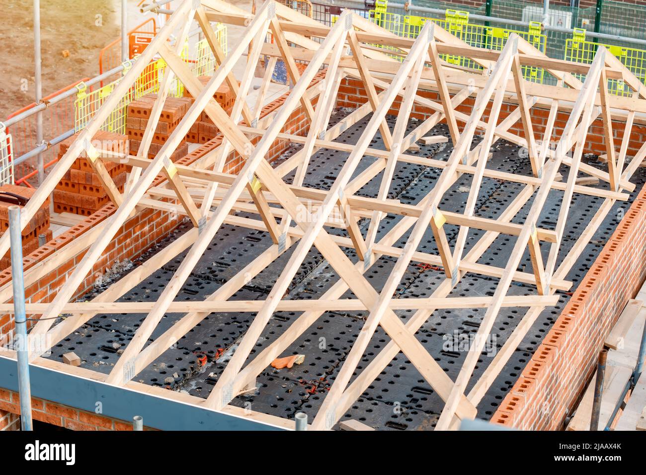 Construction site with a house being built from brick and timber ...