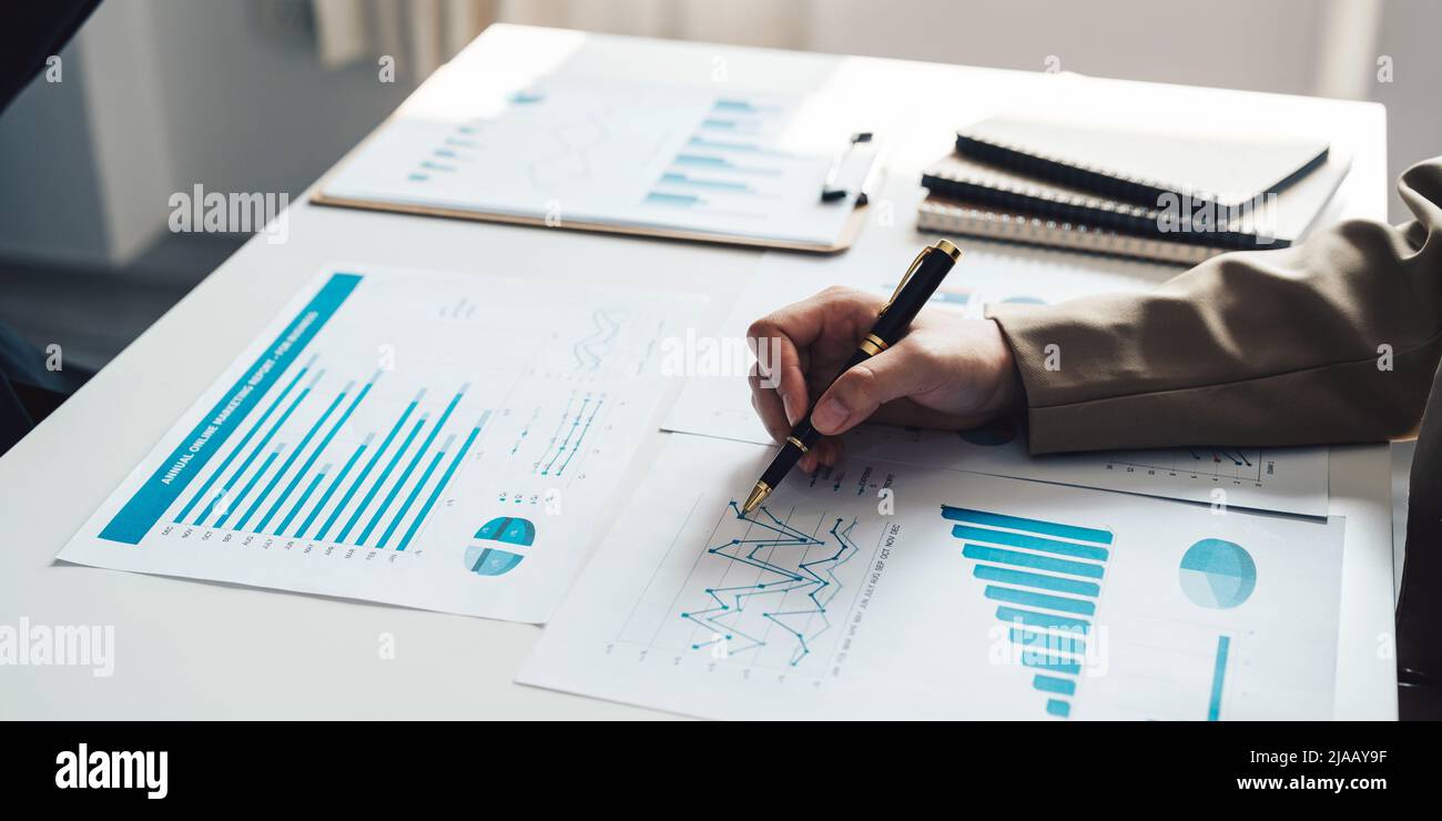 Business accounting woman using calculator for do math finance on ... Business accounting woman using calculator for do math finance on ...