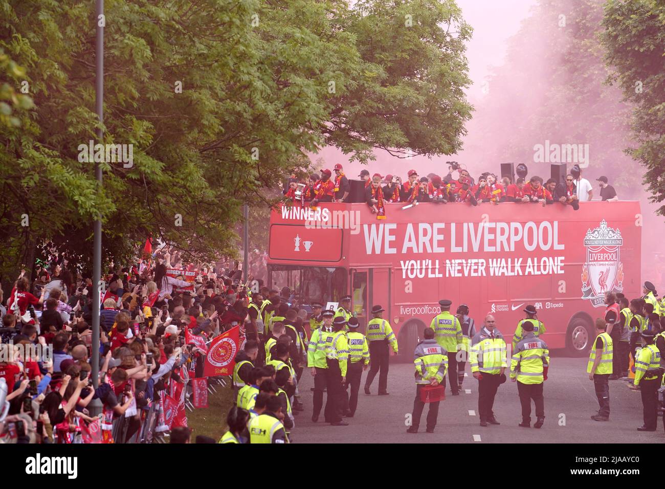 A general view ofLiverpool players passing fans in a open-top bus ...