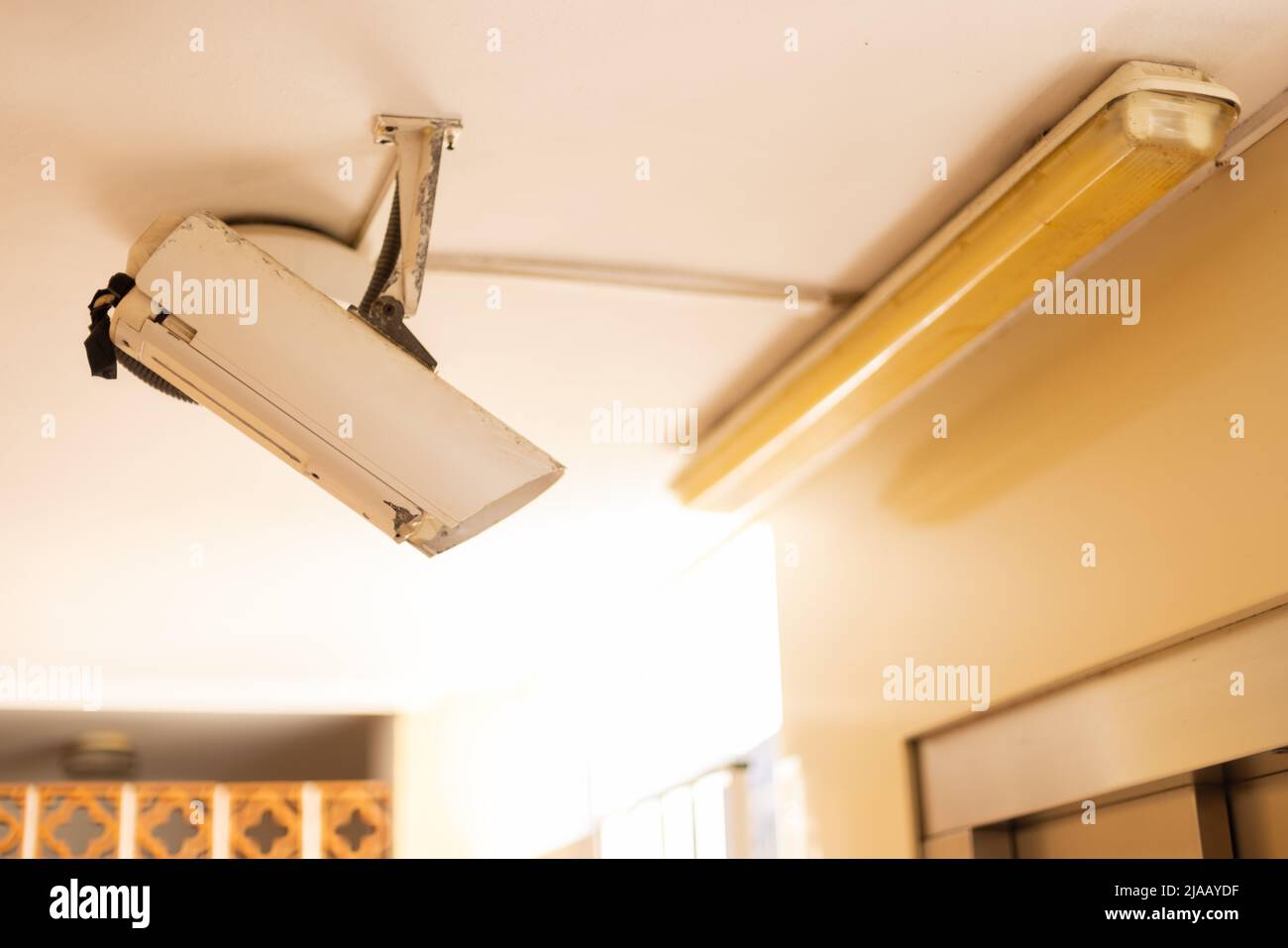 Old security control camera on a ceiling Stock Photo - Alamy