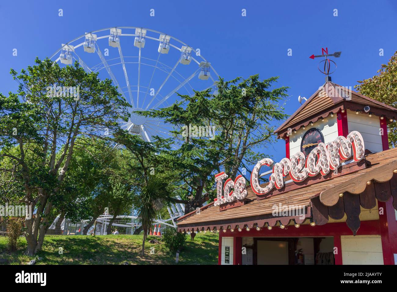 Ferris wheel and ice cream parlour Stock Photo - Alamy