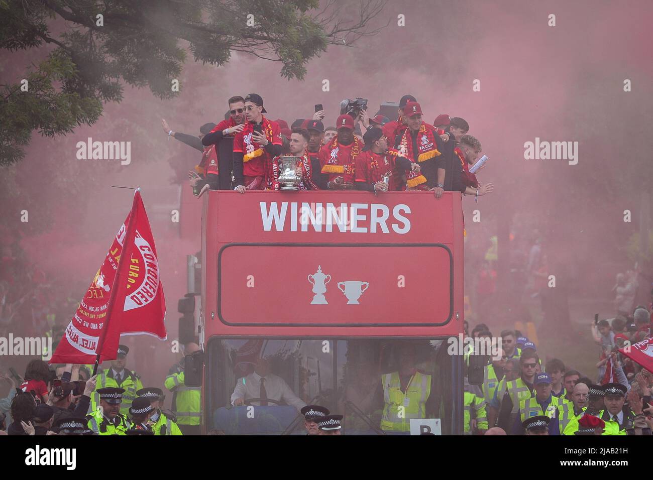 The Liverpool FC squad celebrate during the open top bus parade through ...