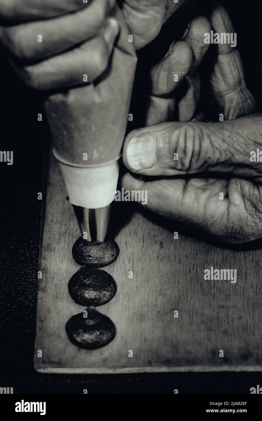 Chocolate making process with a pastry case Stock Photo - Alamy