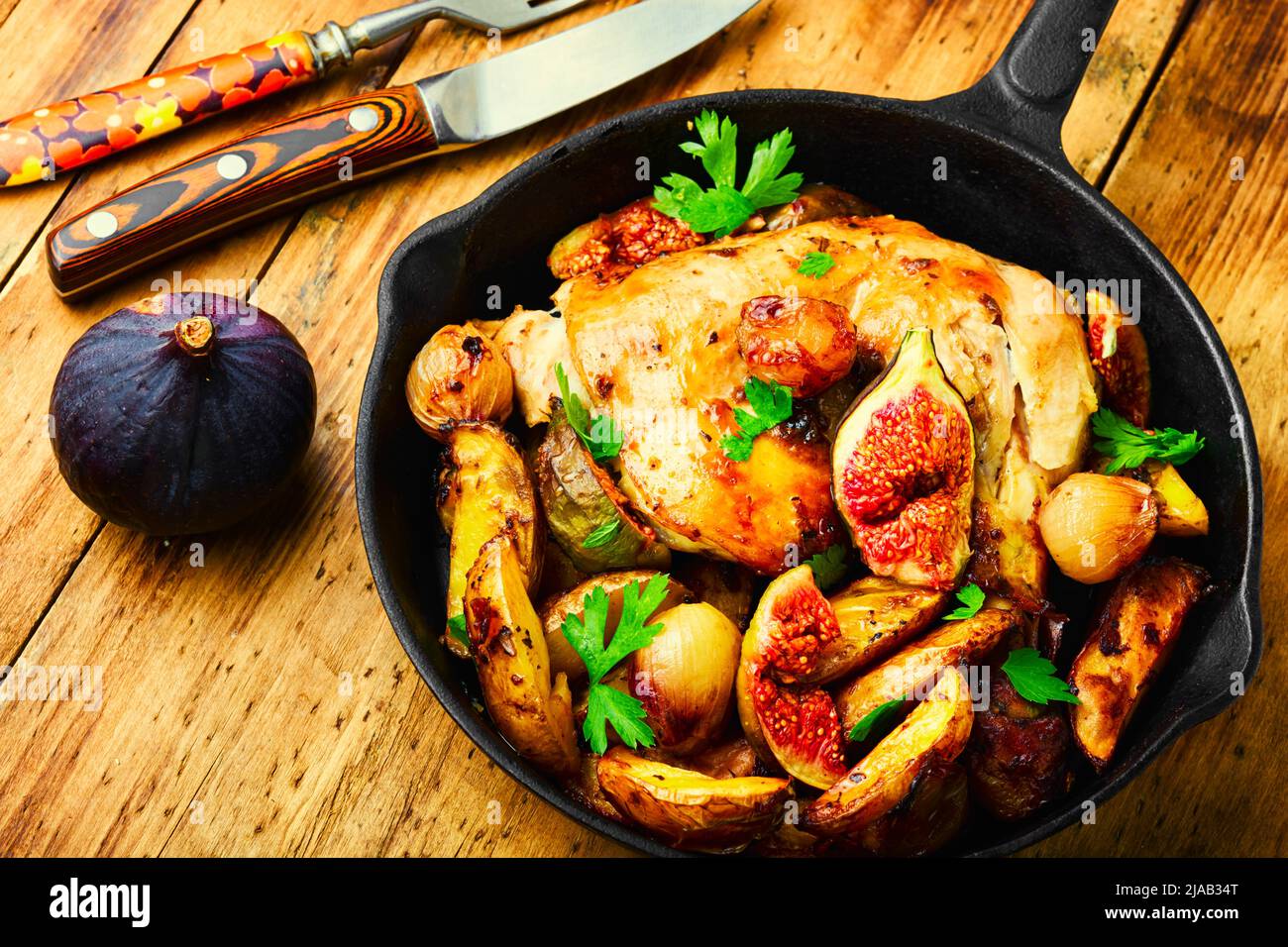Chicken meat roasted with potatoes and figs.Meat cooked with figs Stock ...