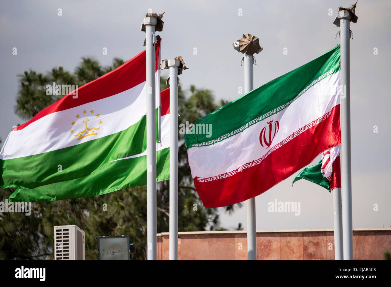Tehran, Iran. 29th May, 2022. The flags of Iran, right, and Tajikistan ...