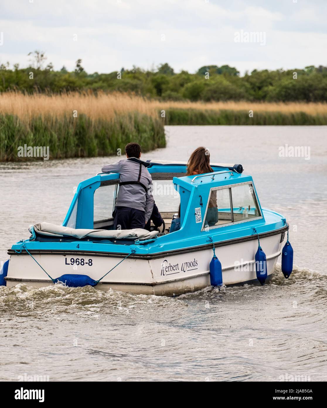 Horning, Norfolk, UK – May 28 2022. A Herbert Woods leisure day boat on ...