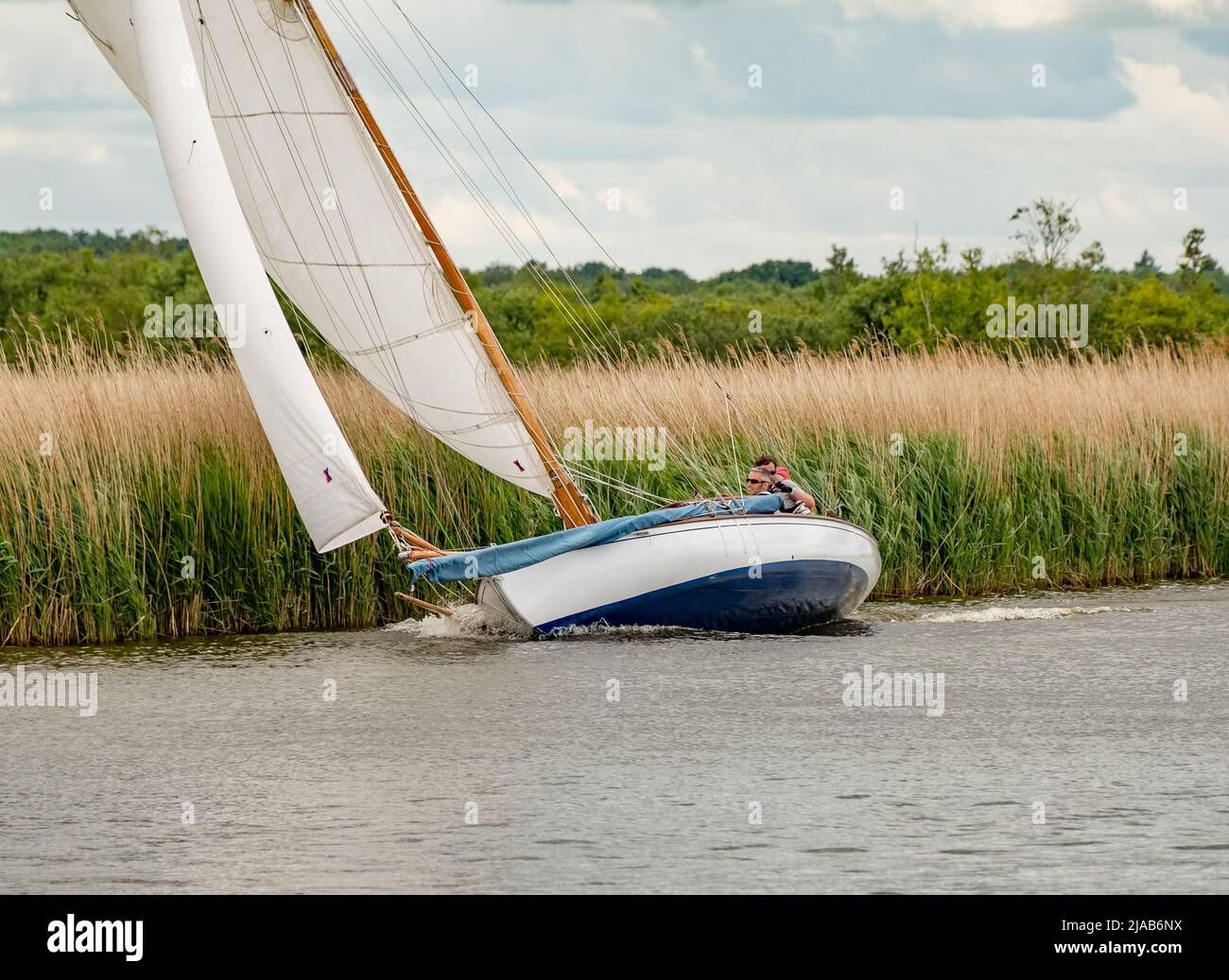 Horning, Norfolk, UK – May 28 2022. A traditional river cruiser sailing ...