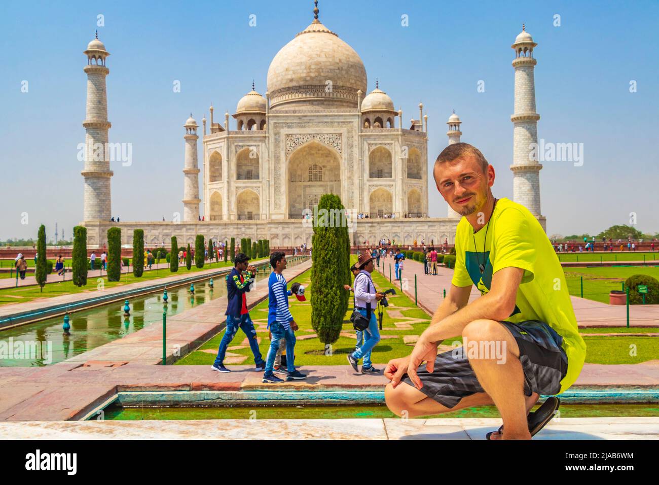 Traveler and tourist poses in front of the famous Taj Mahal in Agra ...
