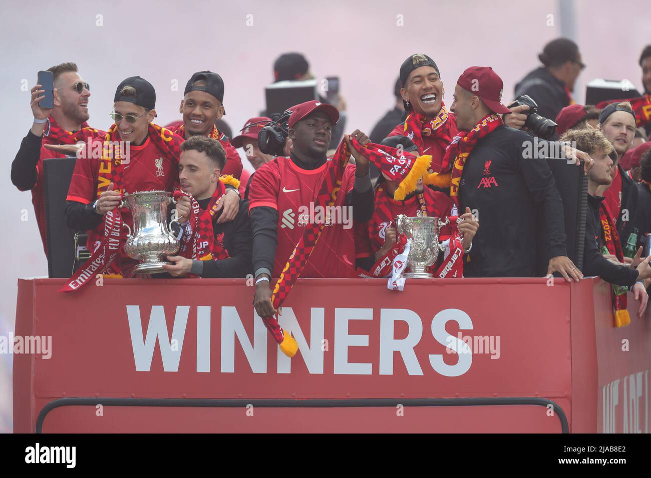 The Liverpool FC squad celebrate during the open top bus parade through ...