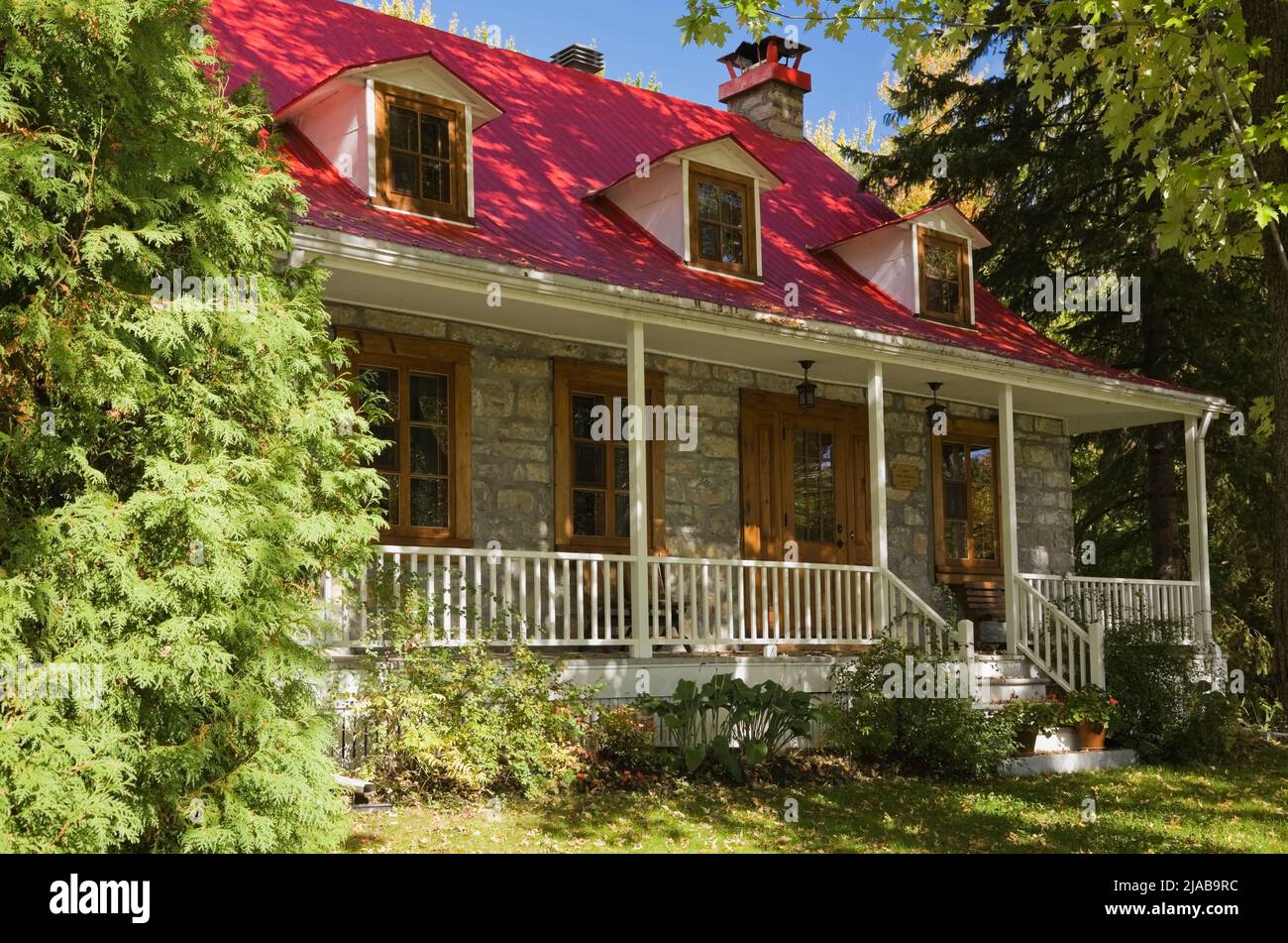 Old circa 1832 Canadiana cottage style fieldstone home with red sheet ...