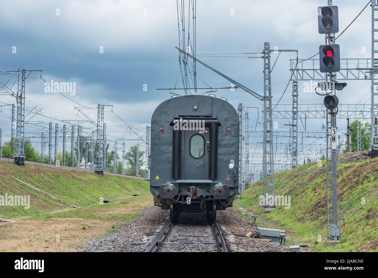 Passenger train approaches to the station Stock Photo - Alamy