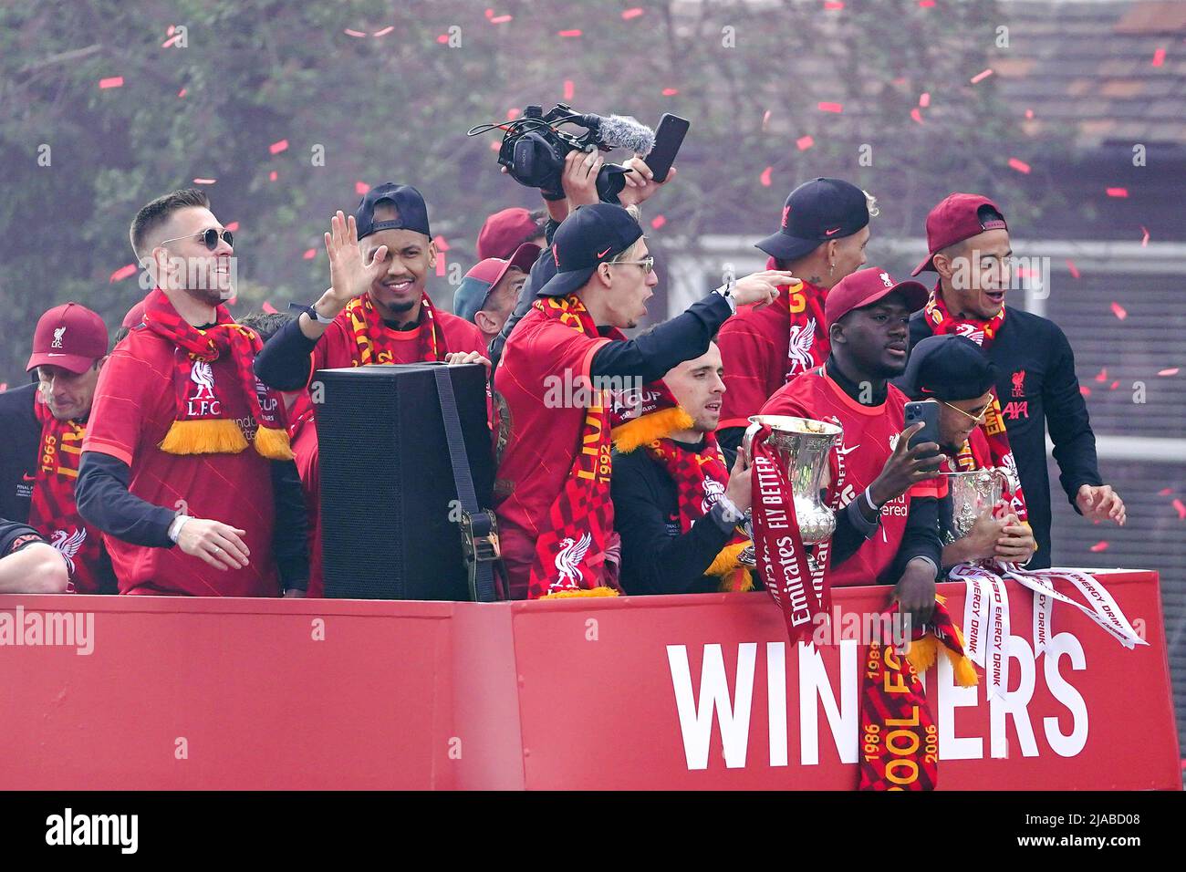 Liverpool players on an open-top bus with the Emirates FA Cup trophy ...