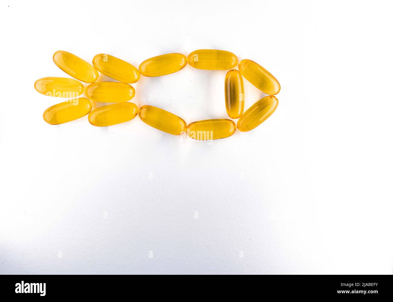 Oily fish, in capsules, on a white background Stock Photo - Alamy
