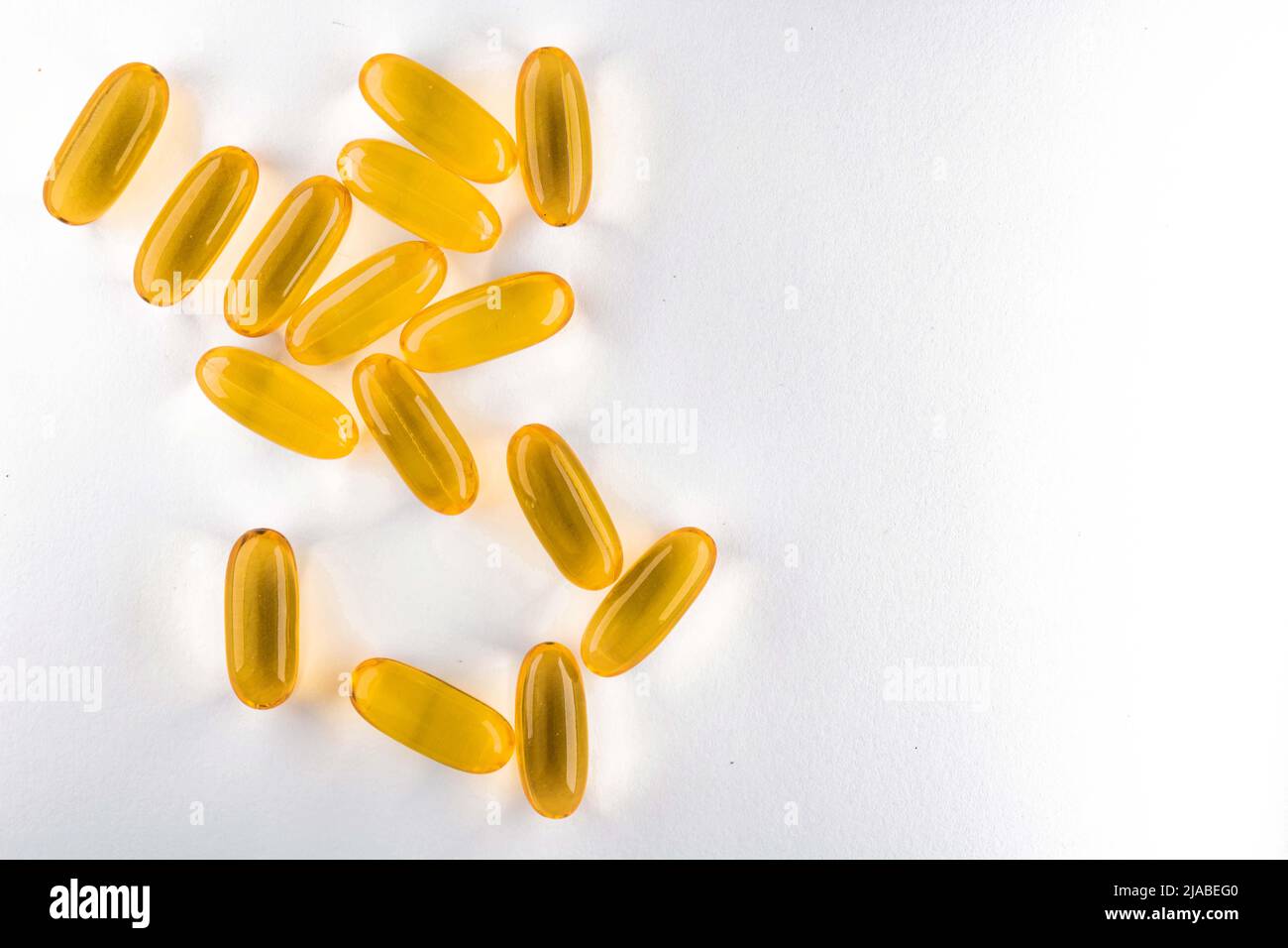 Oily fish, in capsules, on a white background Stock Photo - Alamy