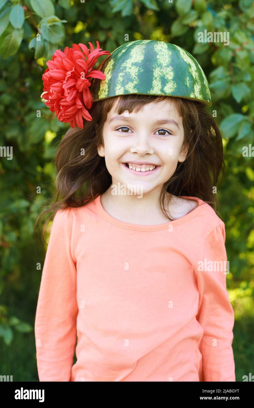 Funny female kid with watermelon. Summer child picnic. Kindergarden ...