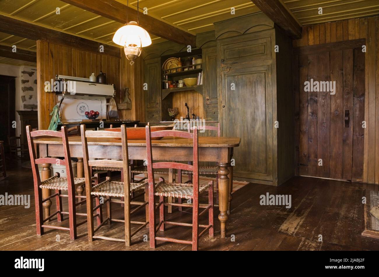 Antique wooden dining table and chairs in kitchen inside old circa 1840 ...