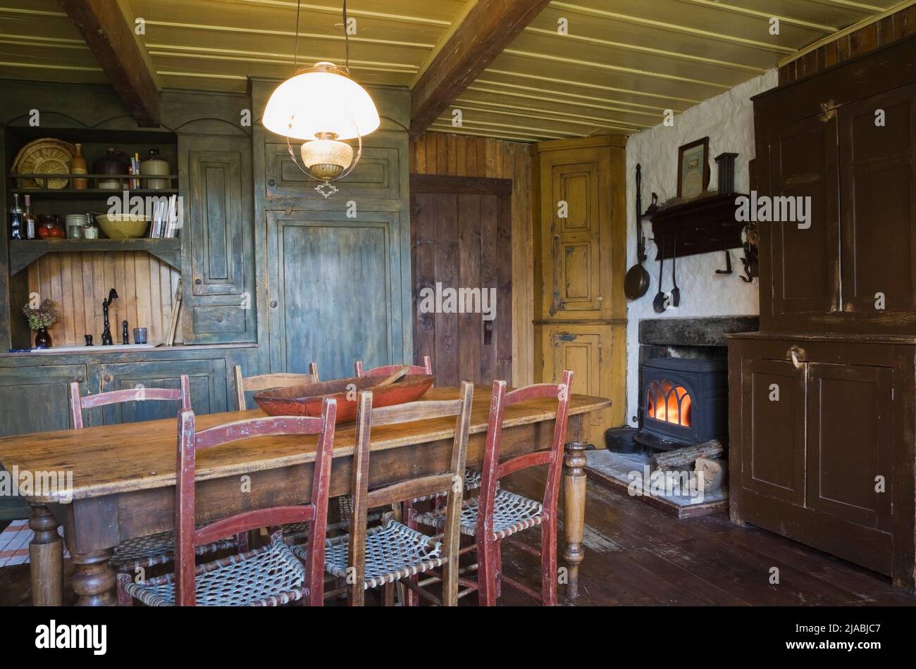 Antique wooden dining table and chairs in kitchen inside old circa 1840 ...