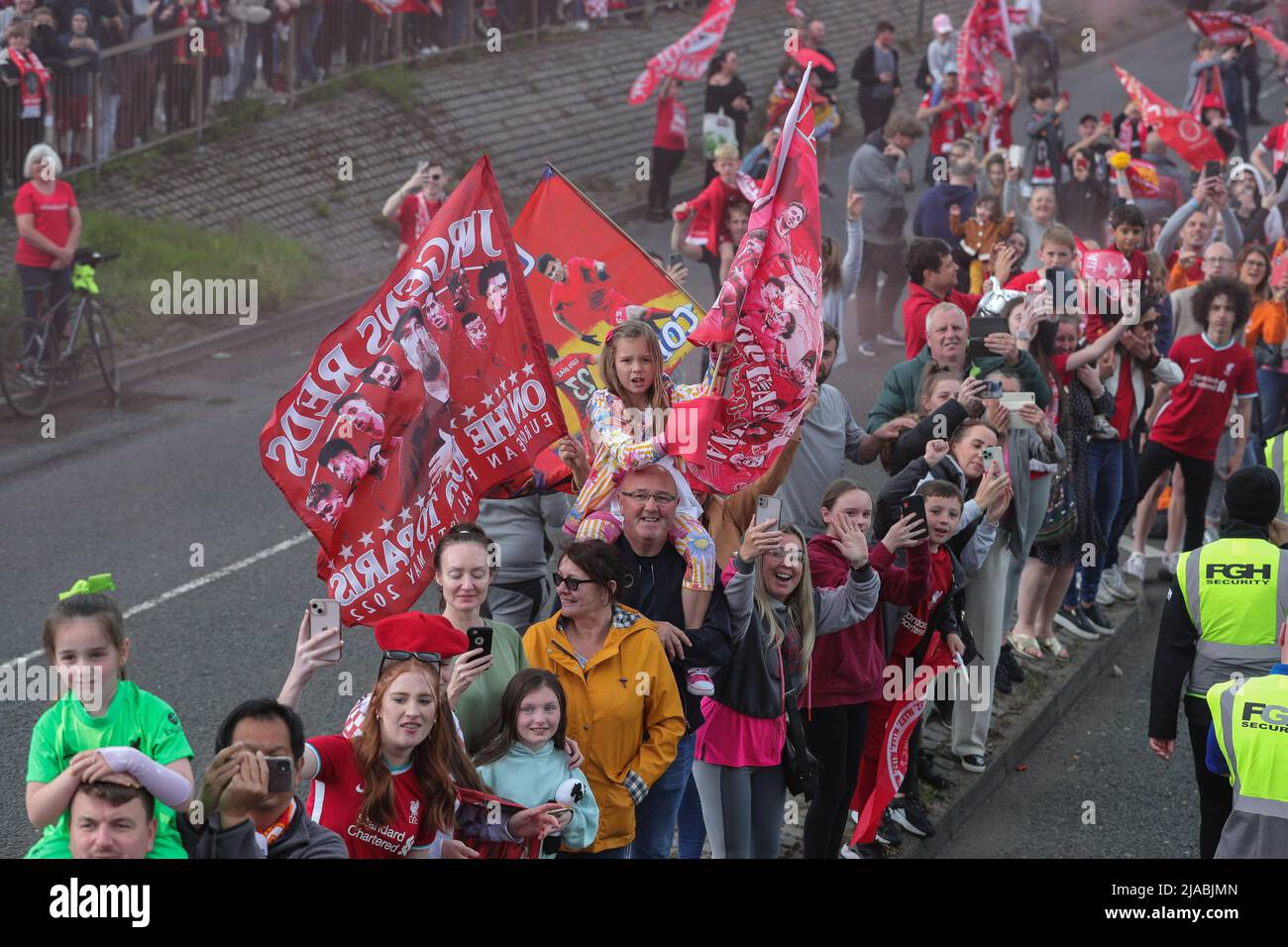 Supporters cheer on the Liverpool FC squad as they celebrate during the ...