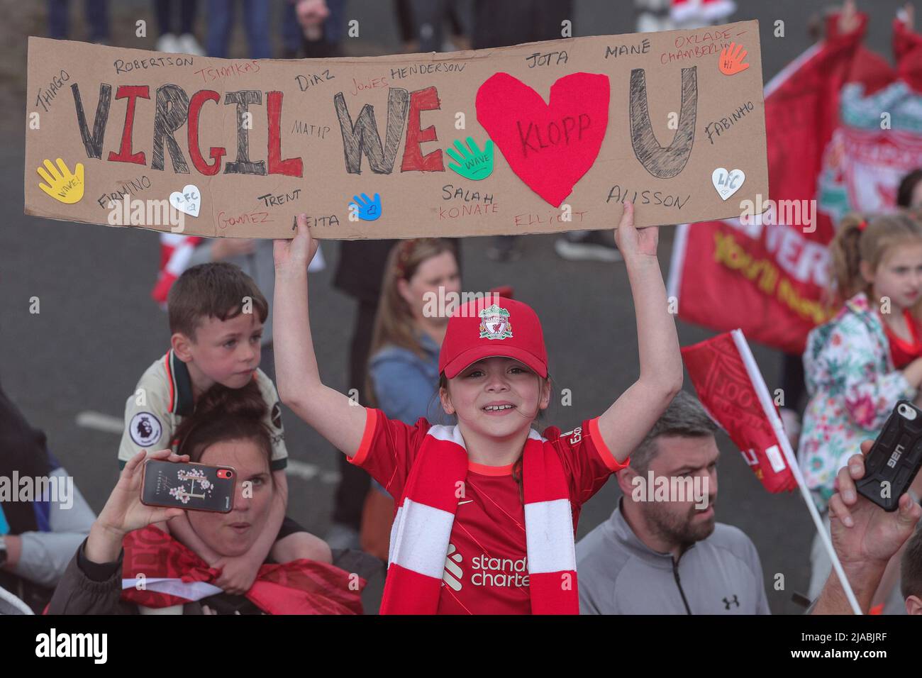 A young Liverpool supporter holds up a ‘Virgil We Love You’ banner as ...