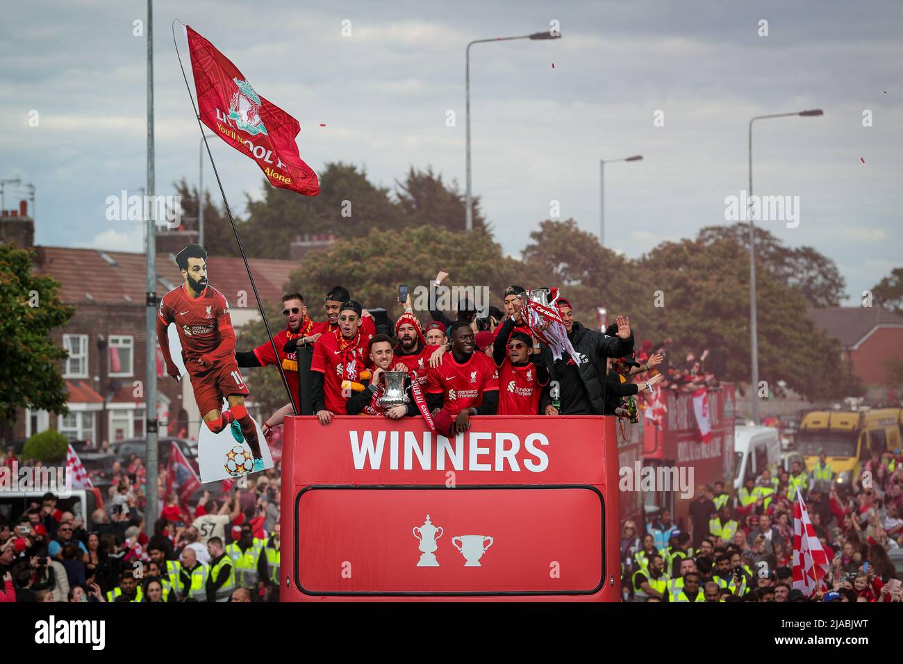The Liverpool FC squad celebrate during the open top bus parade through ...