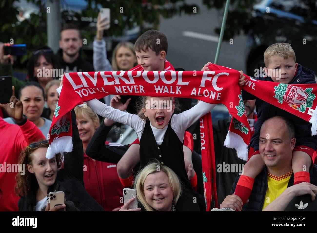 Supporters cheer on the Liverpool FC squad as they celebrate during the ...
