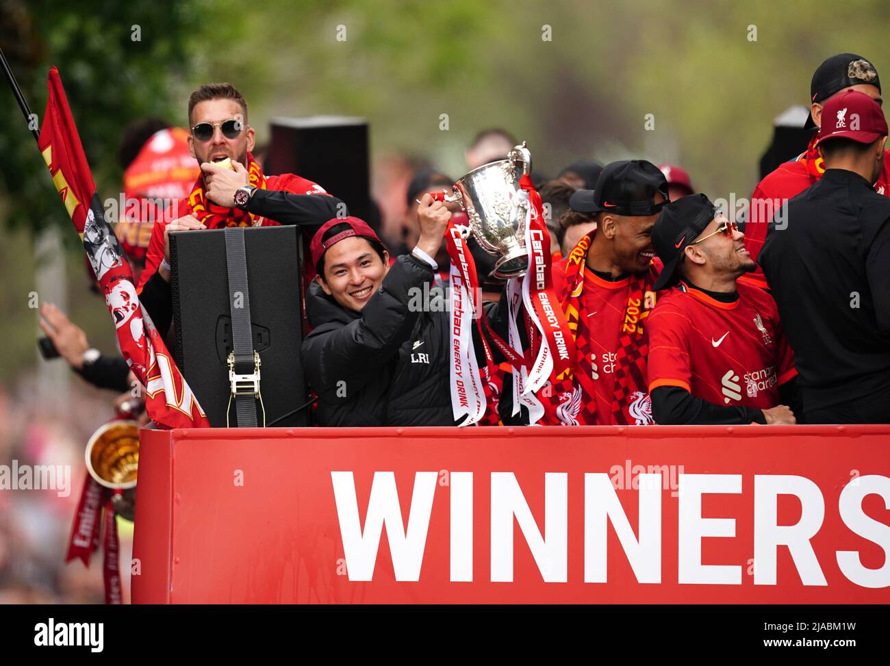 Liverpool's Takumi Minamino with the Carabao Cup trophy during the ...