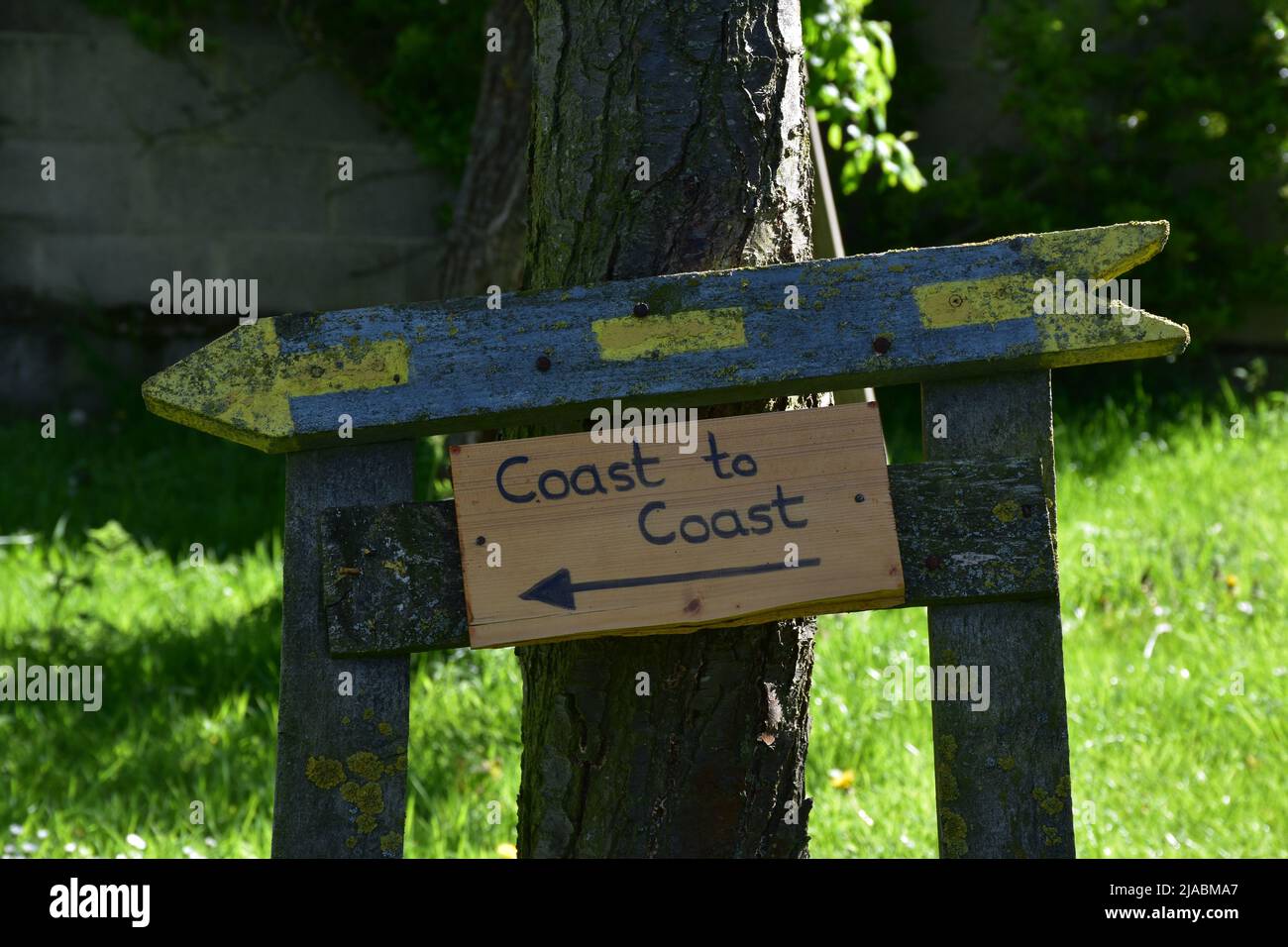 Directional home made coast to coast sign post Stock Photo - Alamy