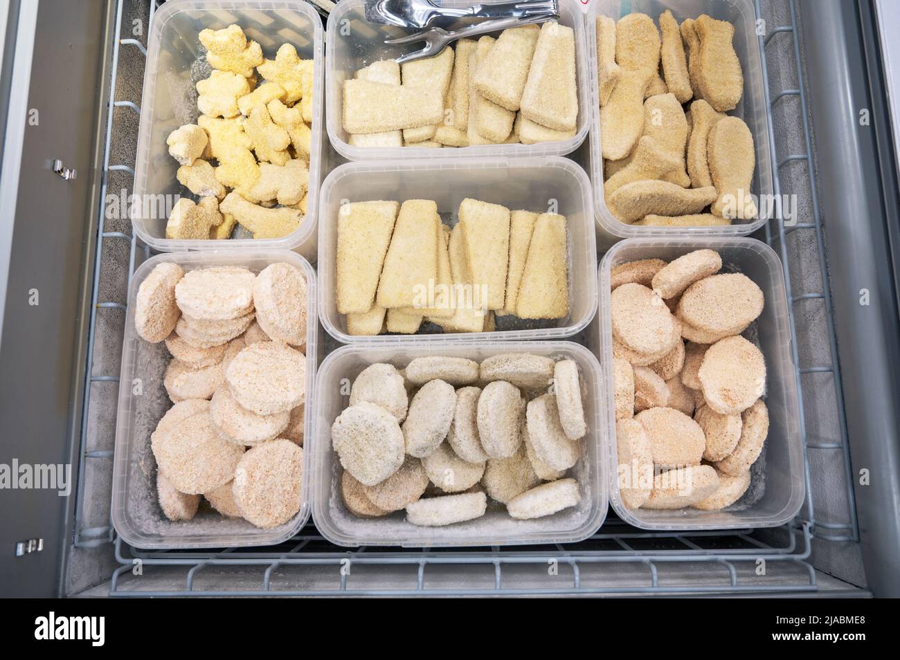 Frozen fish semifinished in fridge at the fish market. Healthy eating ...