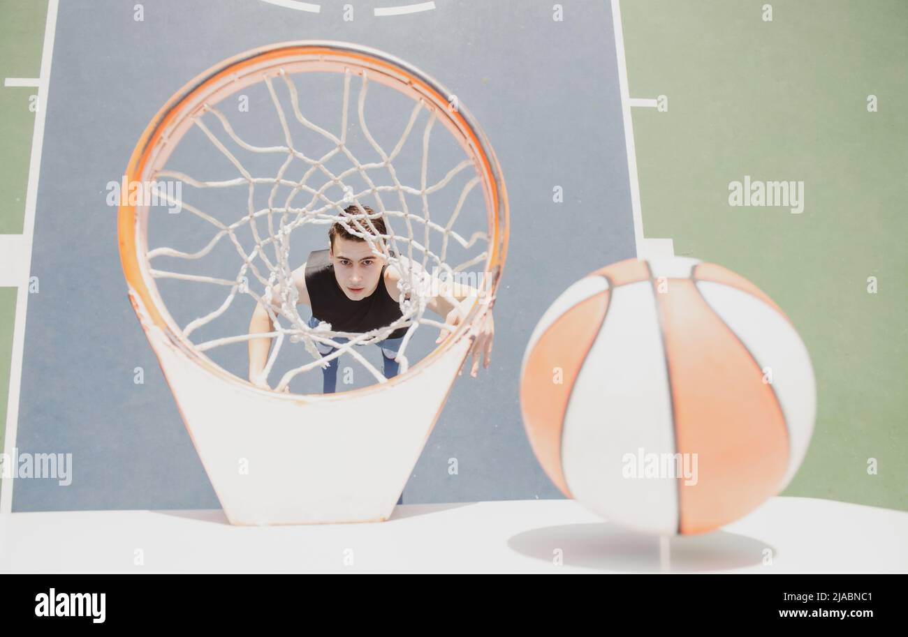 Basketball player. Sports and basketball. Man jumps and throws a ball ...